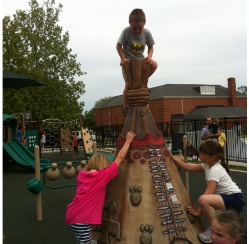 kids climbing on teepee | Accessible Playgrounds